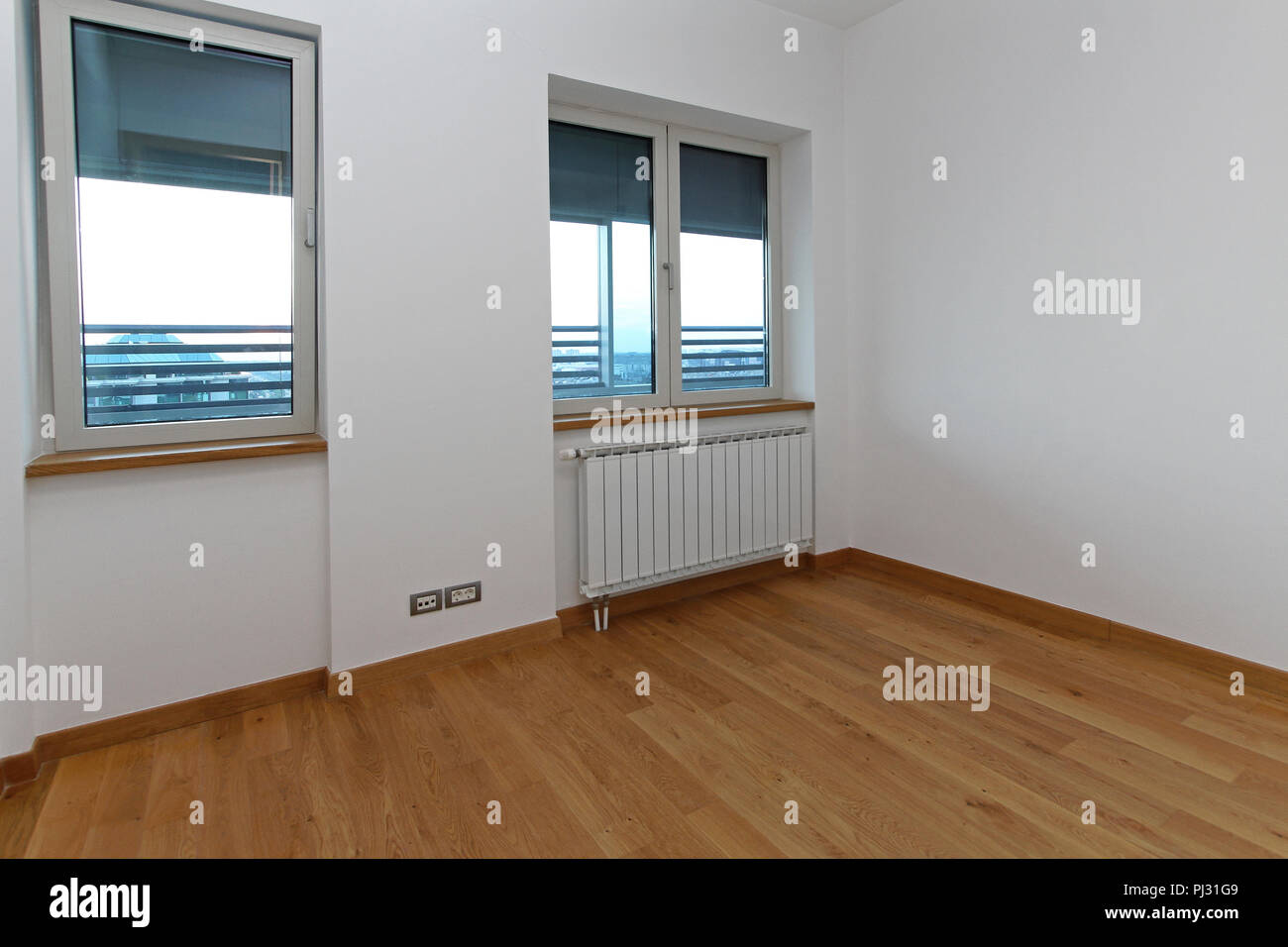 New empty small room in renovated home Stock Photo - Alamy
