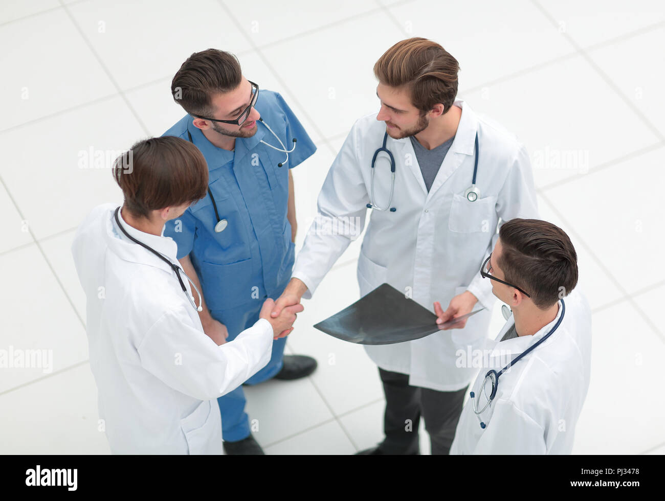 handshake two doctors at the meeting Stock Photo - Alamy