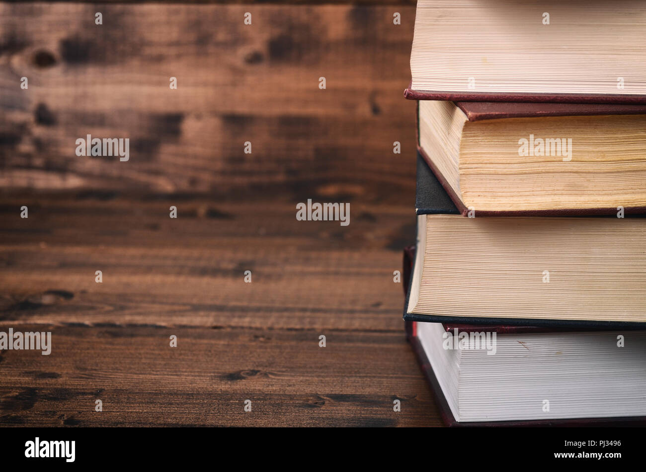 Old Law books on the brown wooden background, brown wooden backdrop ...