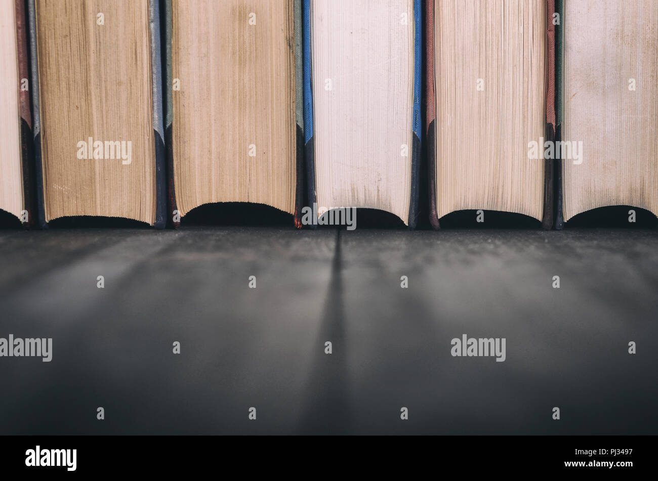 Old Law books on the black wooden background, black wooden backdrop ...