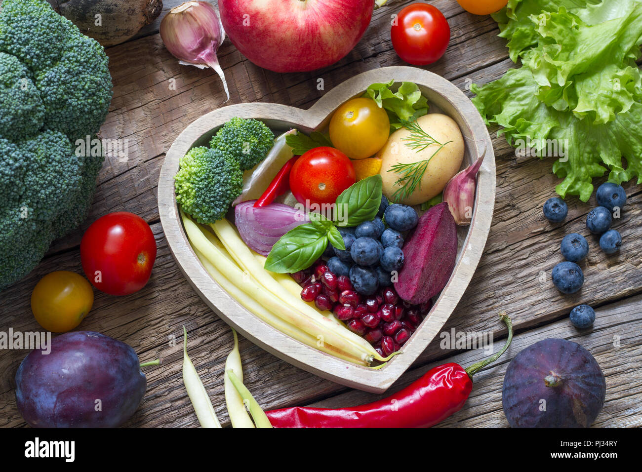 Healthy food in heart diet cooking concept with fresh fruits and ...