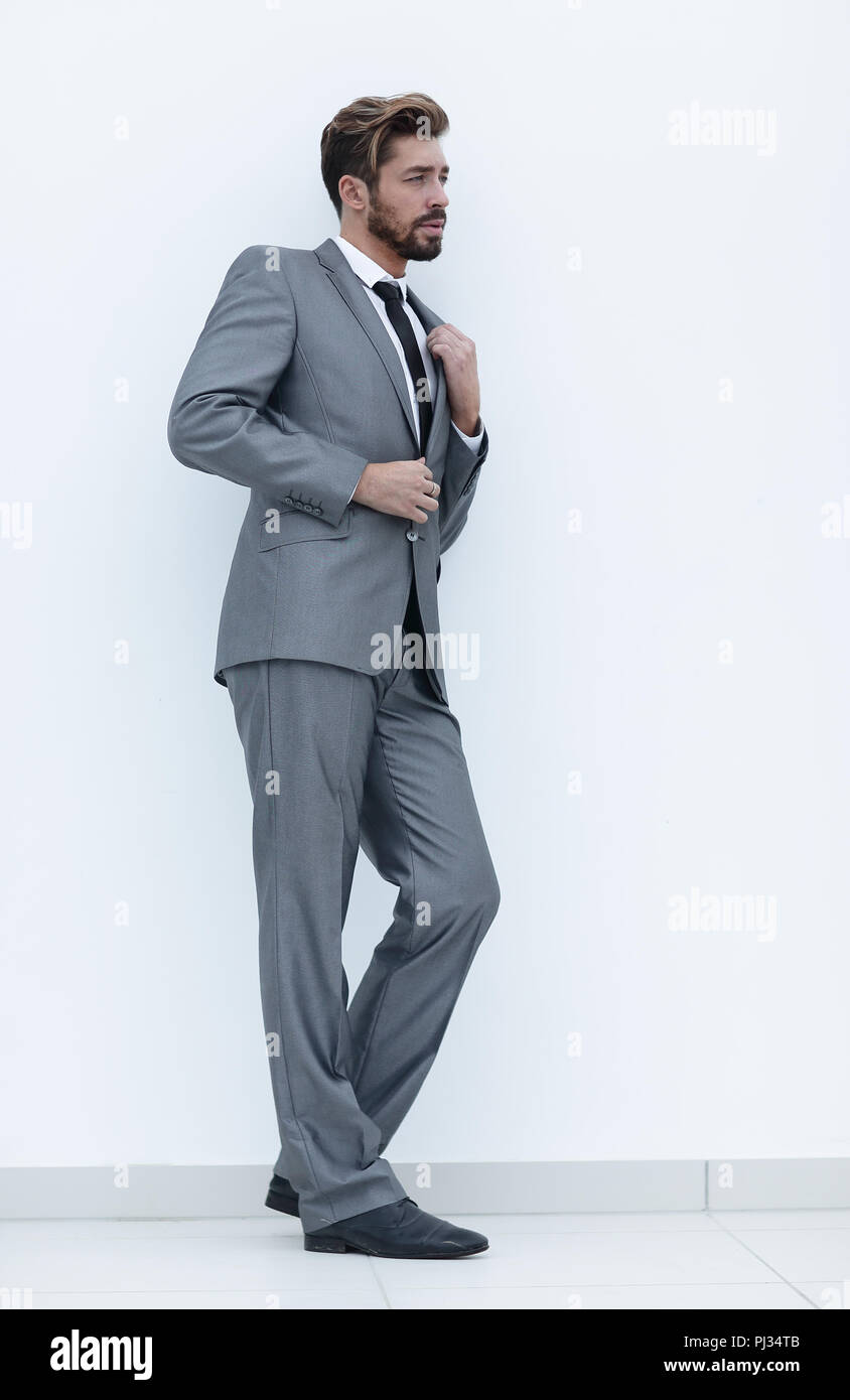 side view of an arrogant stylish man in suit Stock Photo - Alamy