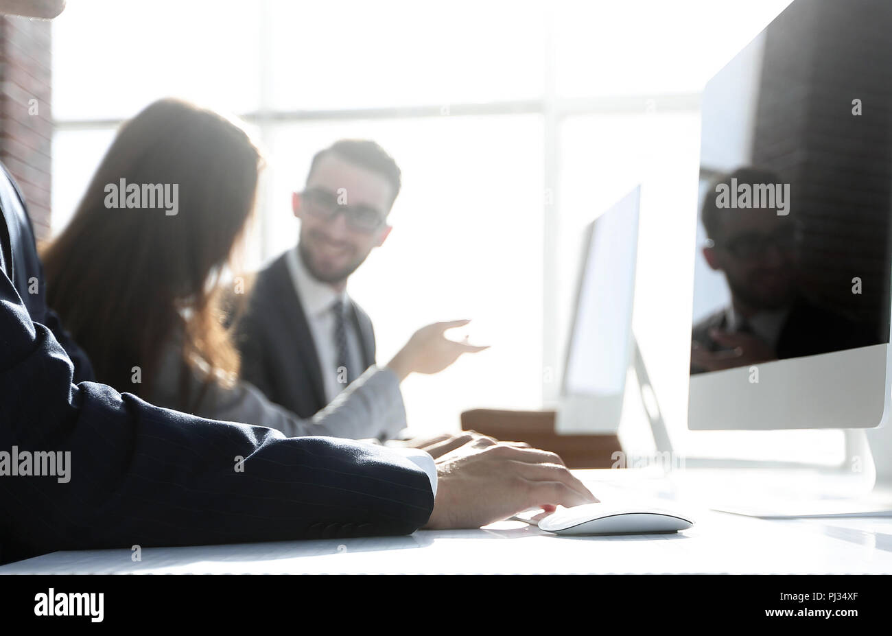 office employees sitting at their work Desk Stock Photo - Alamy