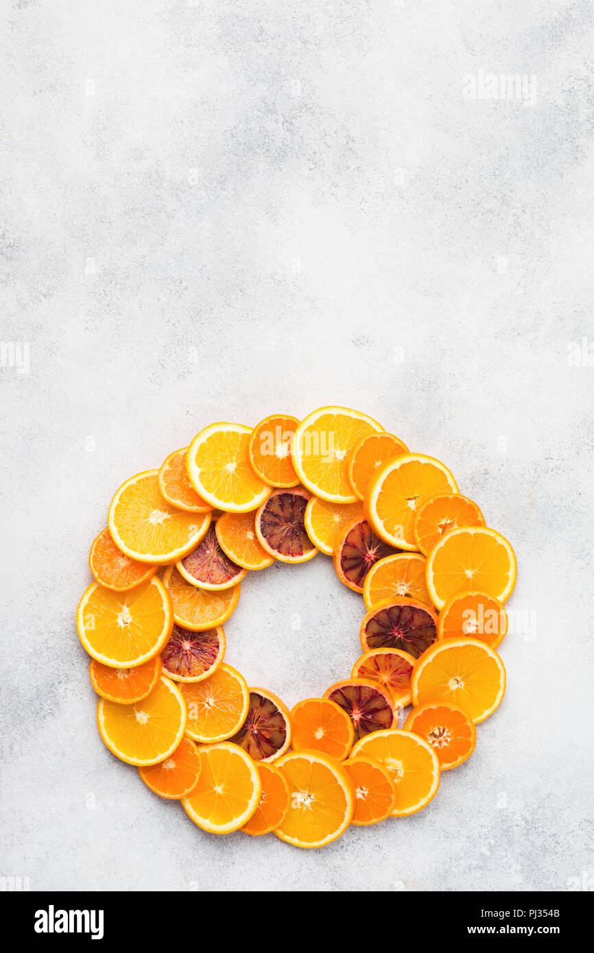 Different varieties of citrus fruits arranged in a circle frame on ...