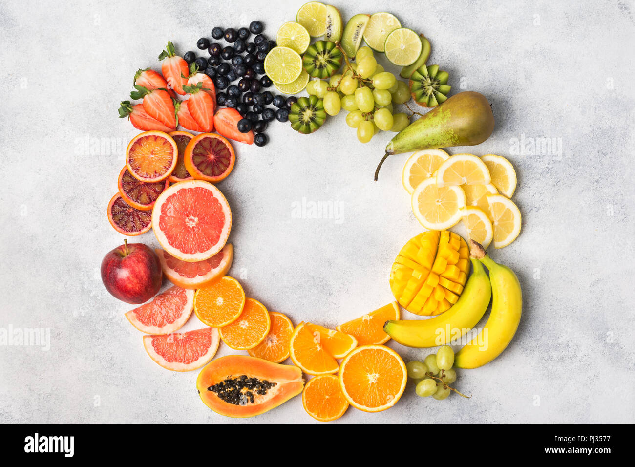 Healthy eating, top view of healthy fruits in rainbow colours arranged ...