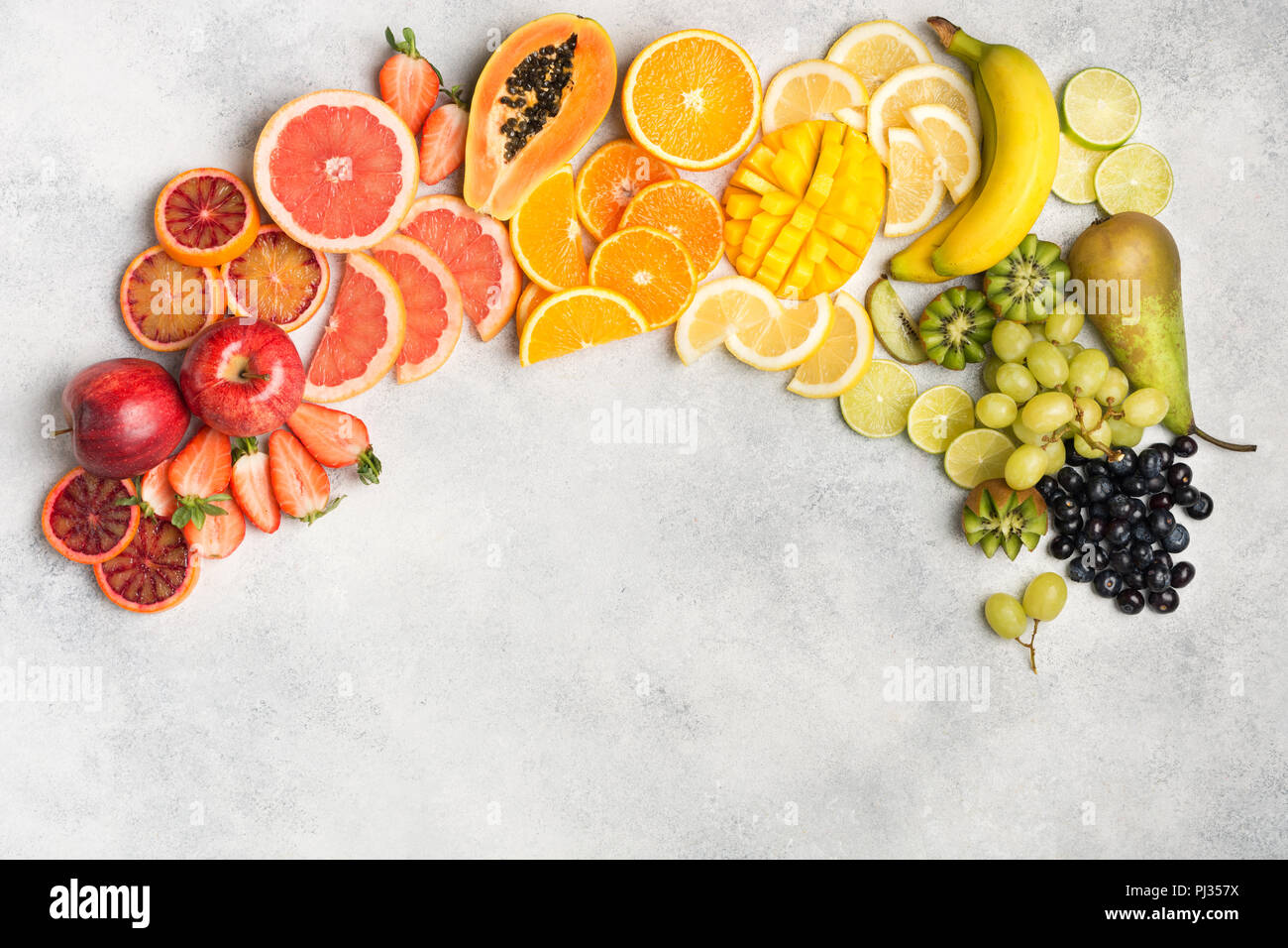 Healthy eating, top view of healthy fruits in rainbow colours ...
