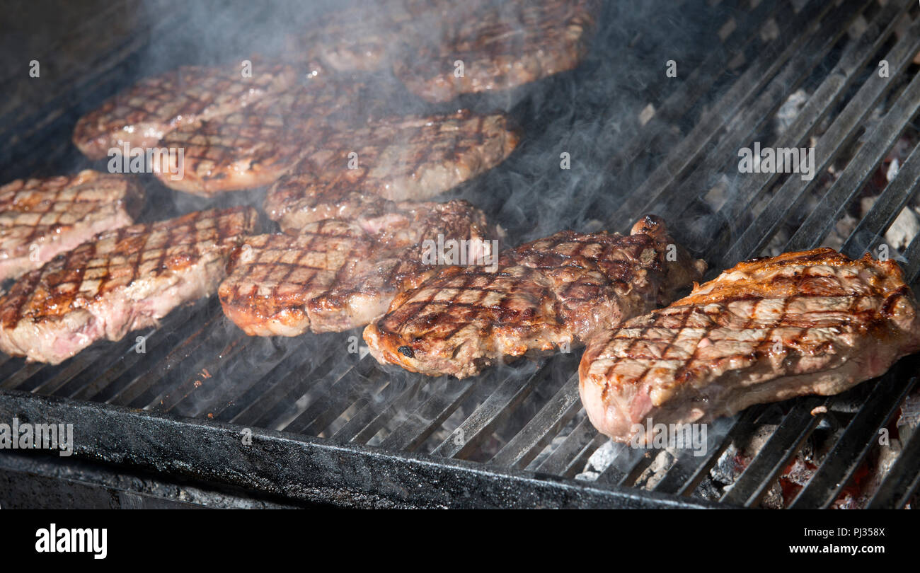 beef steak cooking on an open flame grill Stock Photo - Alamy
