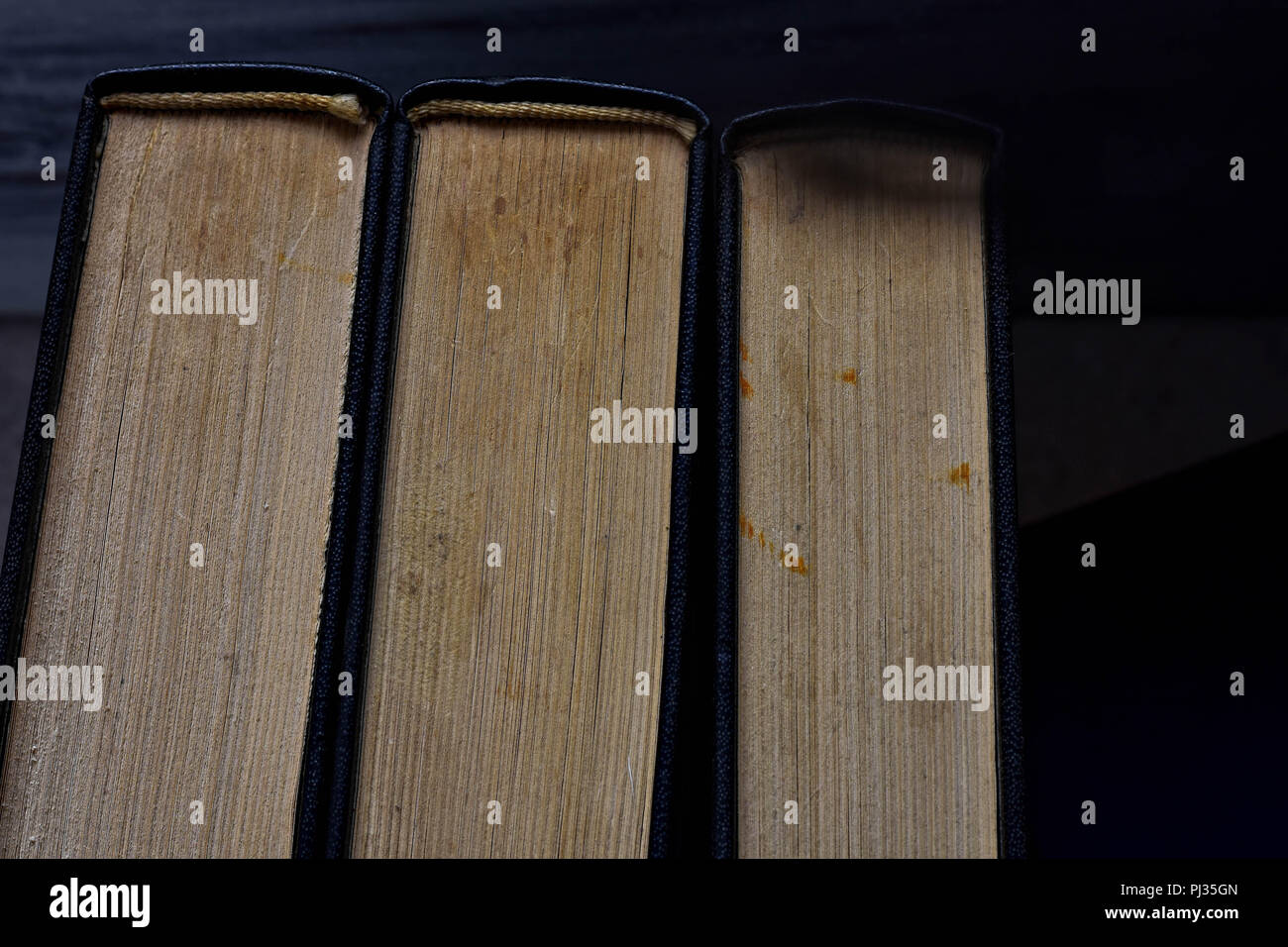 Stack of old dusty books viewed from the top Stock Photo - Alamy