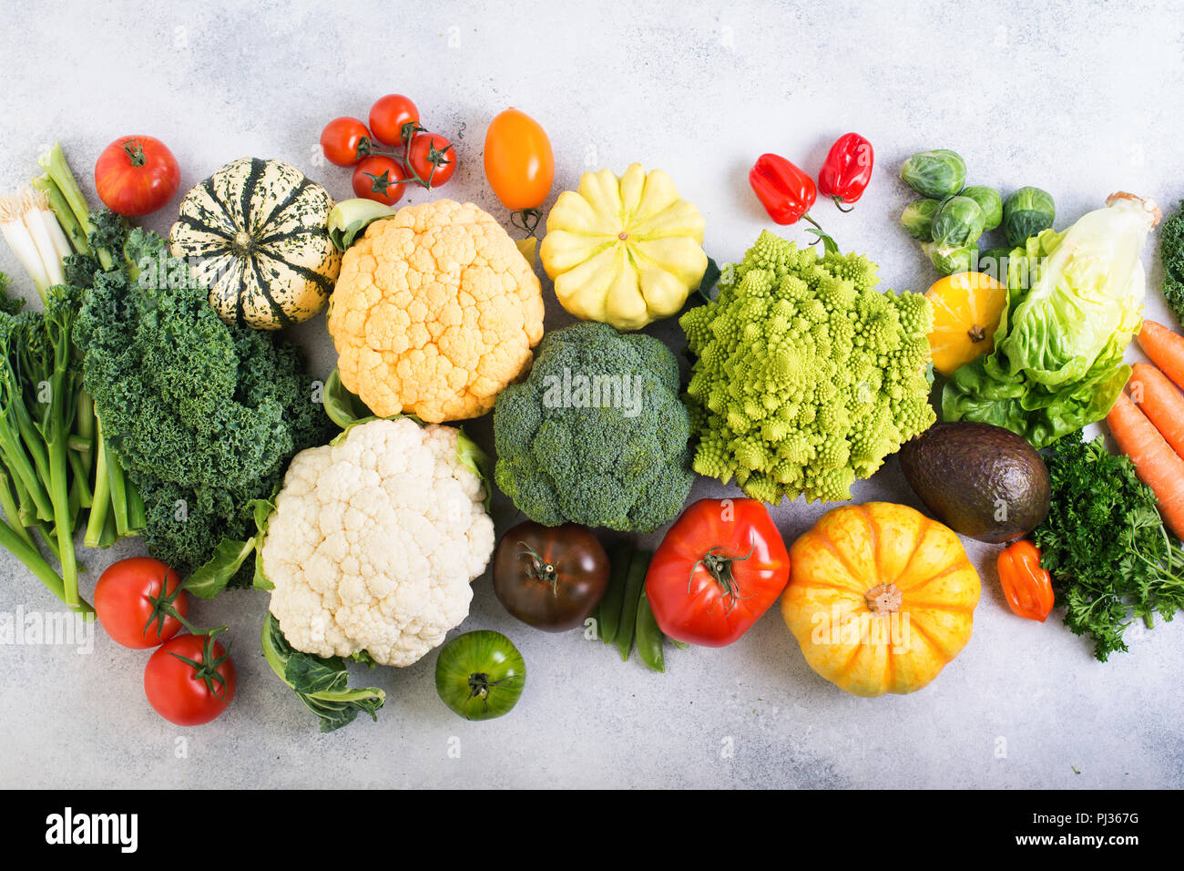 Overhead table top view colorful rainbow vegetables on the light grey ...
