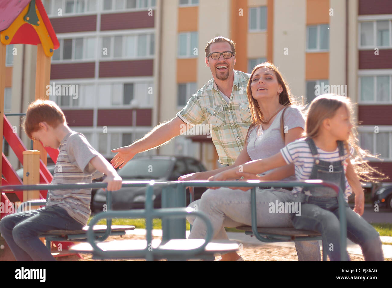 modern young family with children playing in the Playground Stock Photo ...