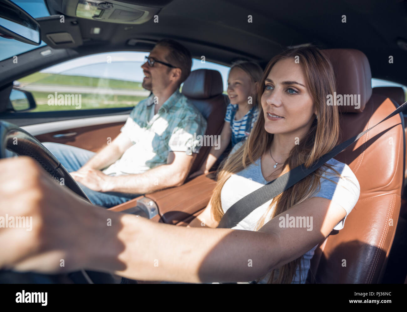 mom driving a family car Stock Photo - Alamy