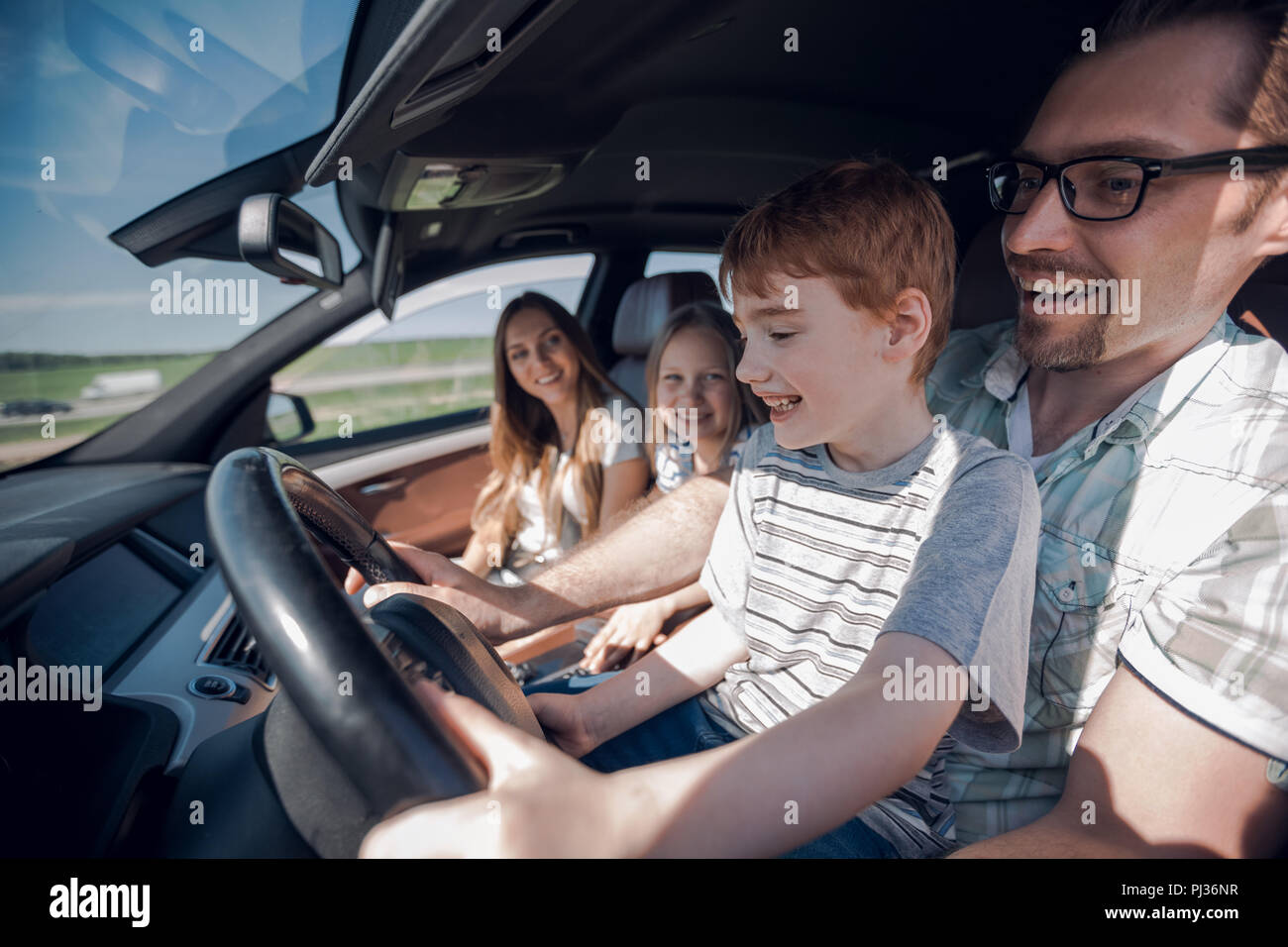 Father teaching his son to drive a car hi-res stock photography and ...
