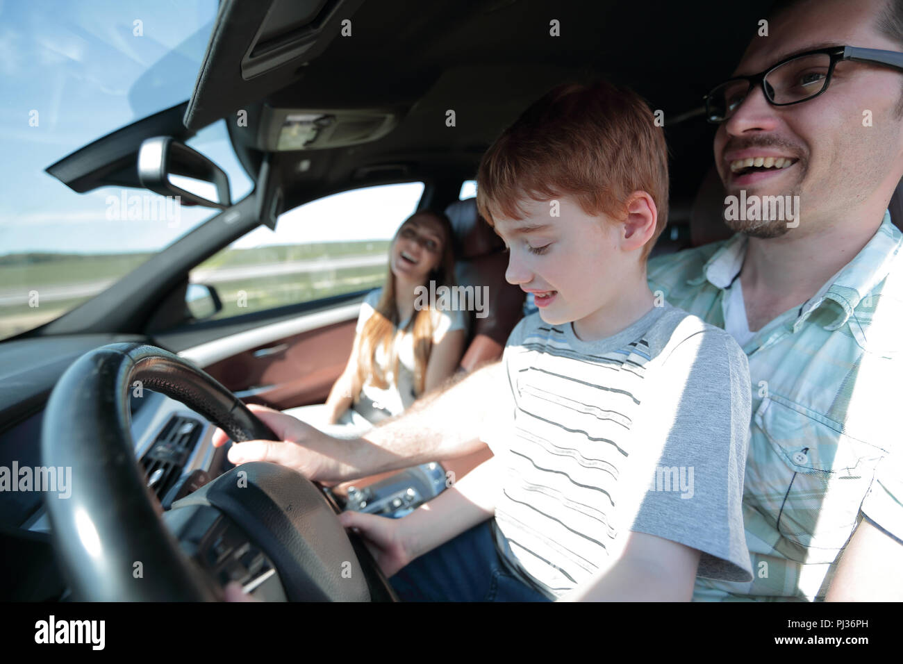Father teaching son to drive car hi-res stock photography and images ...