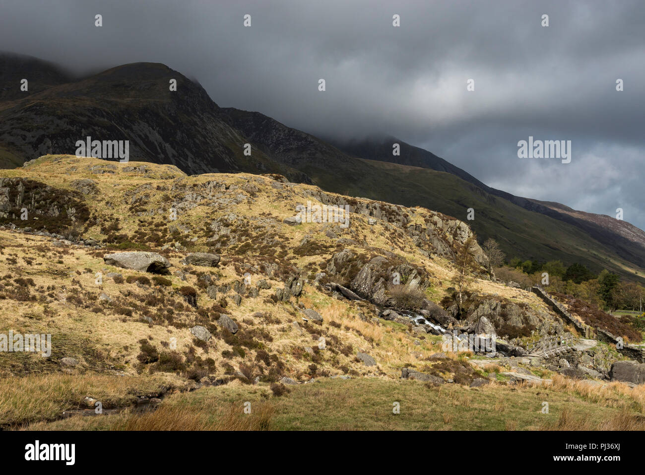 Sunlight on the rugged landscape at Cwm Idwal in Snowdonia national ...