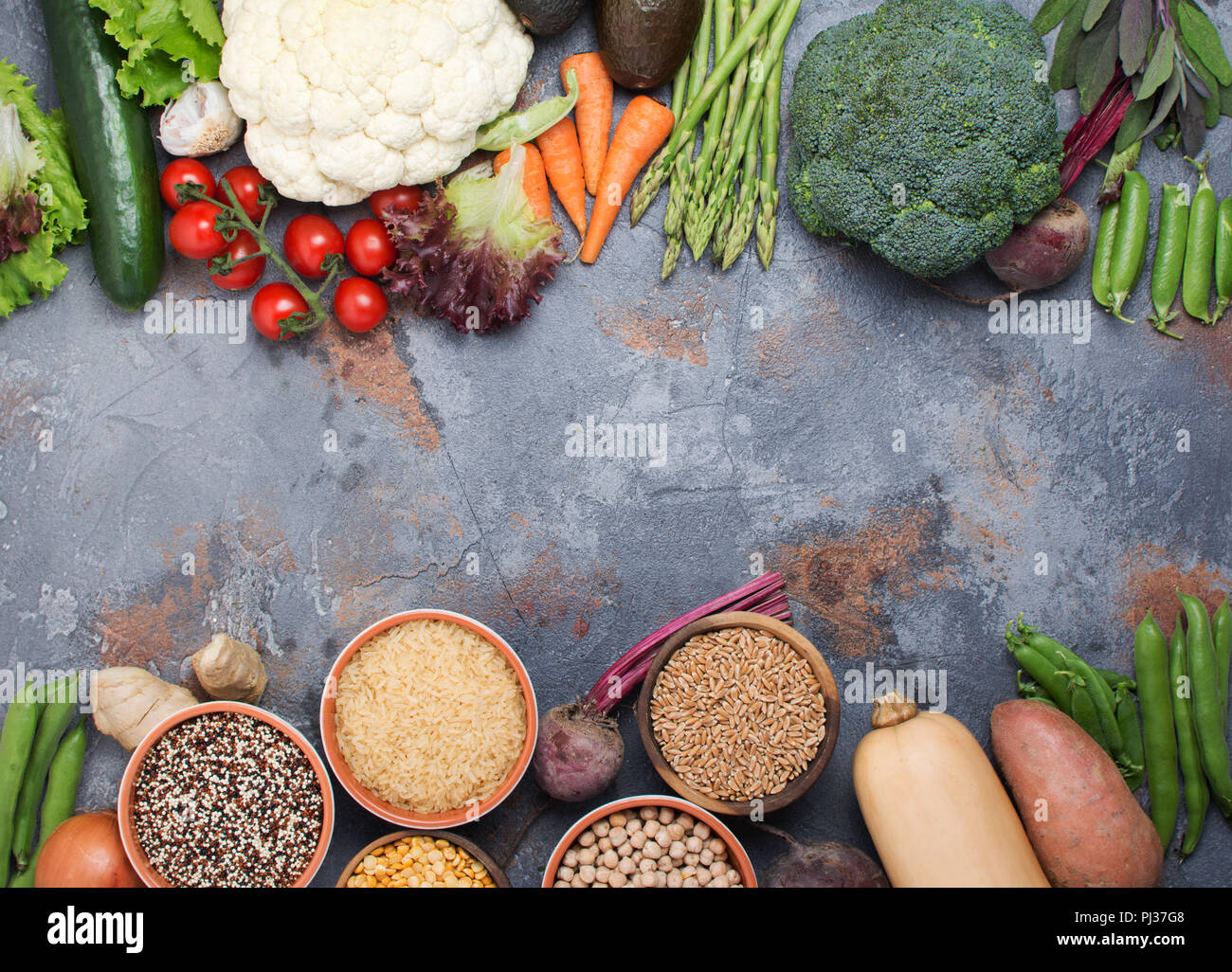 Above view of different vegetables and grains, arranged in a circle ...