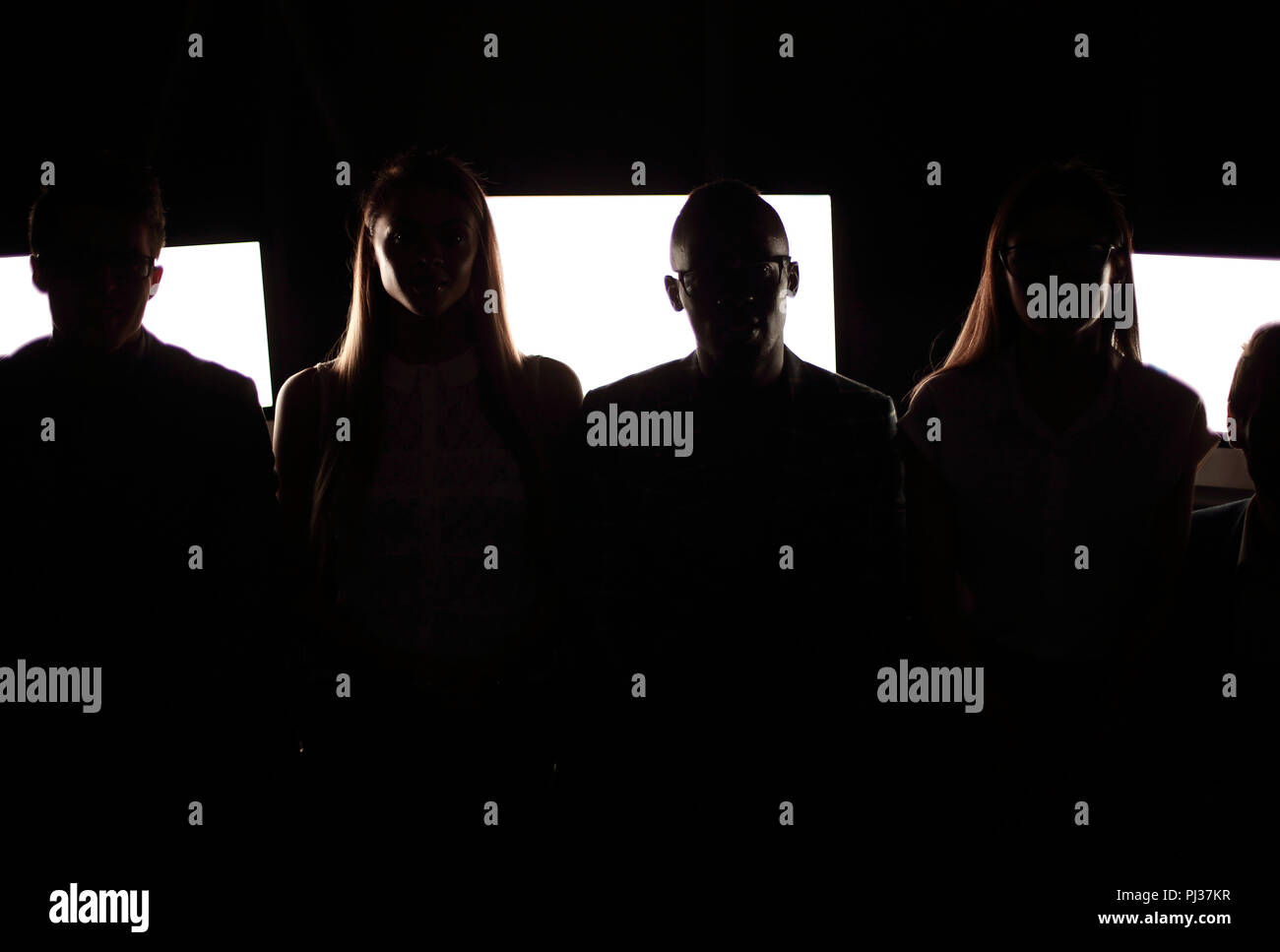 Team computer business dark night hi-res stock photography and images ...