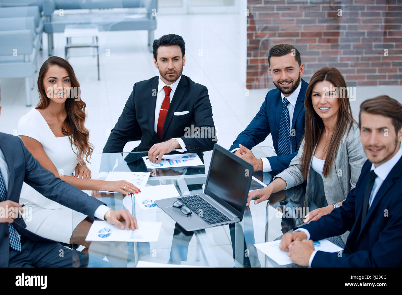 successful business team in the workplace in the office Stock Photo - Alamy