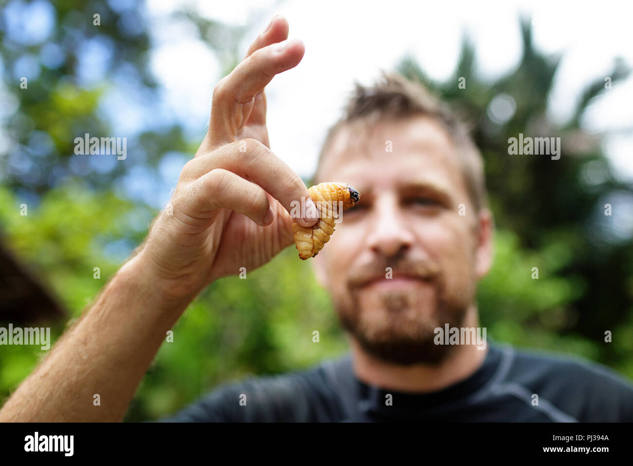 Tourist man eating hands hi-res stock photography and images - Alamy