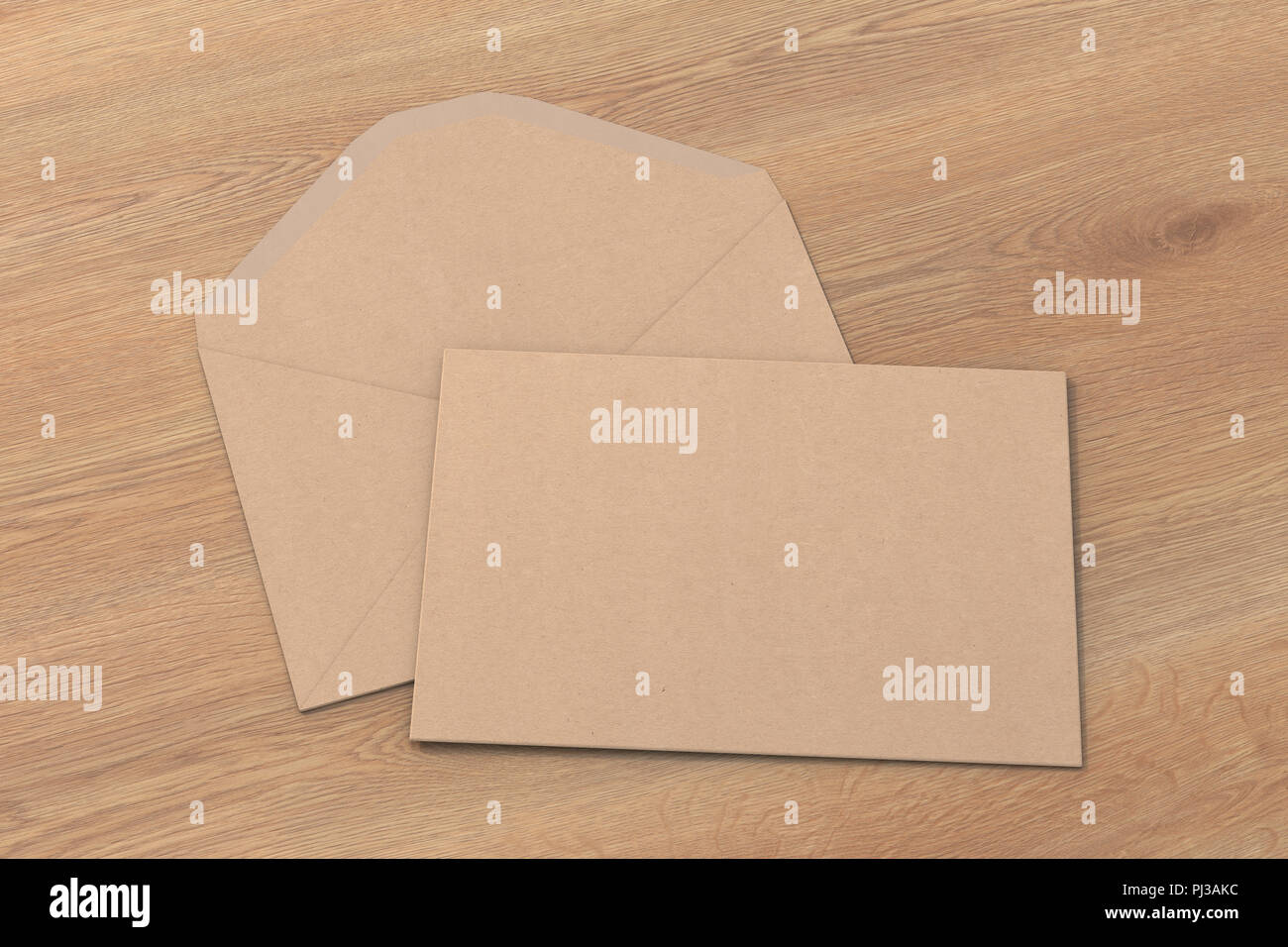 Craft paper blank closed envelope on opened envelope on wooden ...