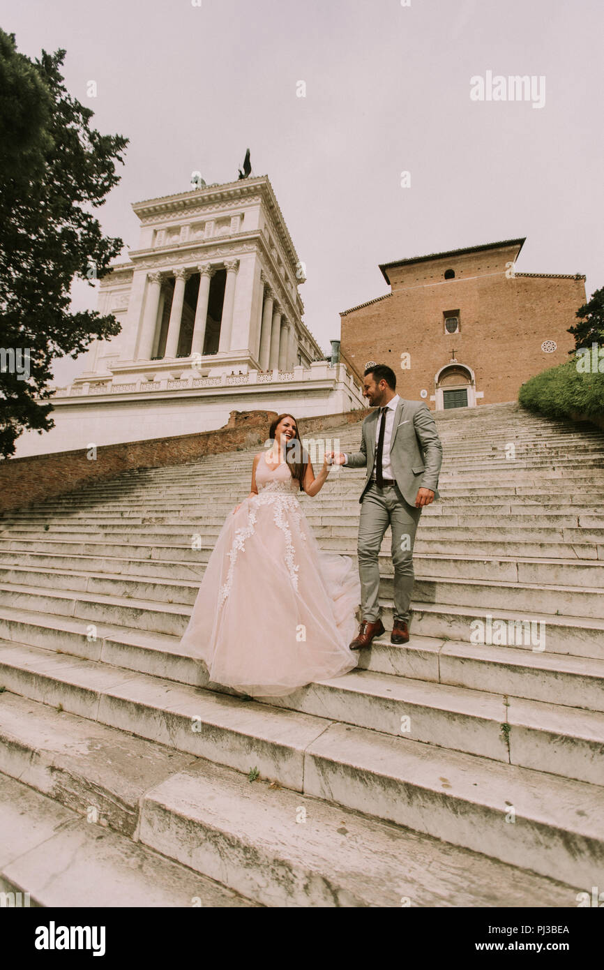 Wedding couple on stairs of Cordonata Capitolina in Rome, Italy Stock ...