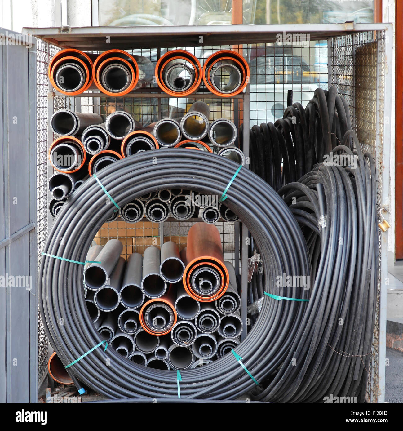 Pipes and Hoses at Shelf in Warehouse Stock Photo - Alamy