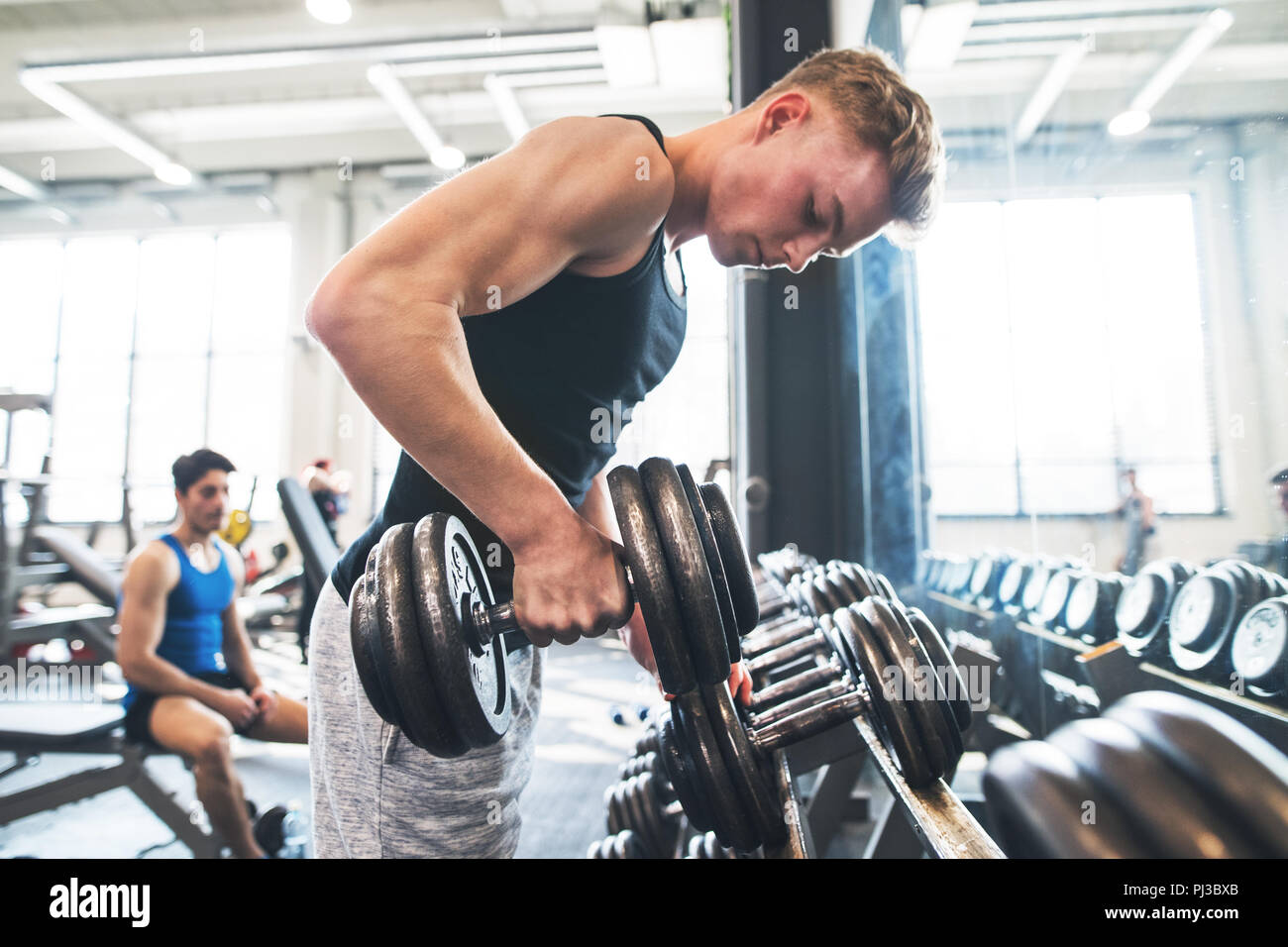 Handsome men exercising in gym hi-res stock photography and images - Alamy