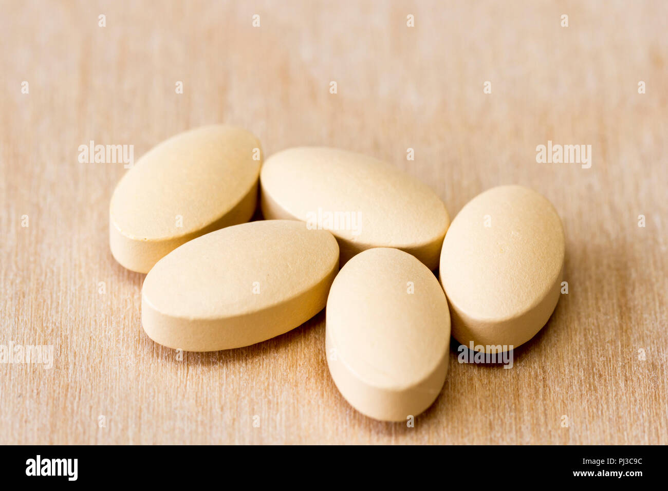 Photograph of Turmeric food supplement tablets close up Stock Photo - Alamy