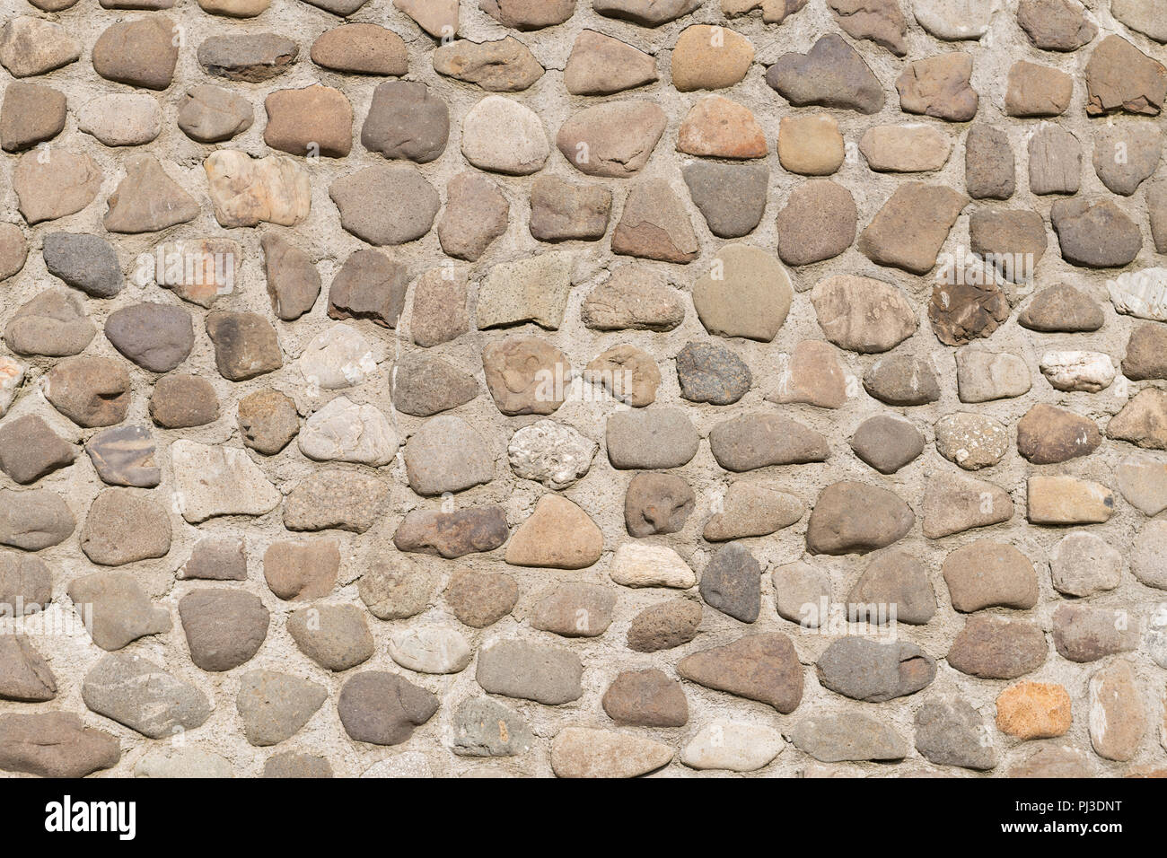 Old stone wall made with irregular blocks background texture with high ...
