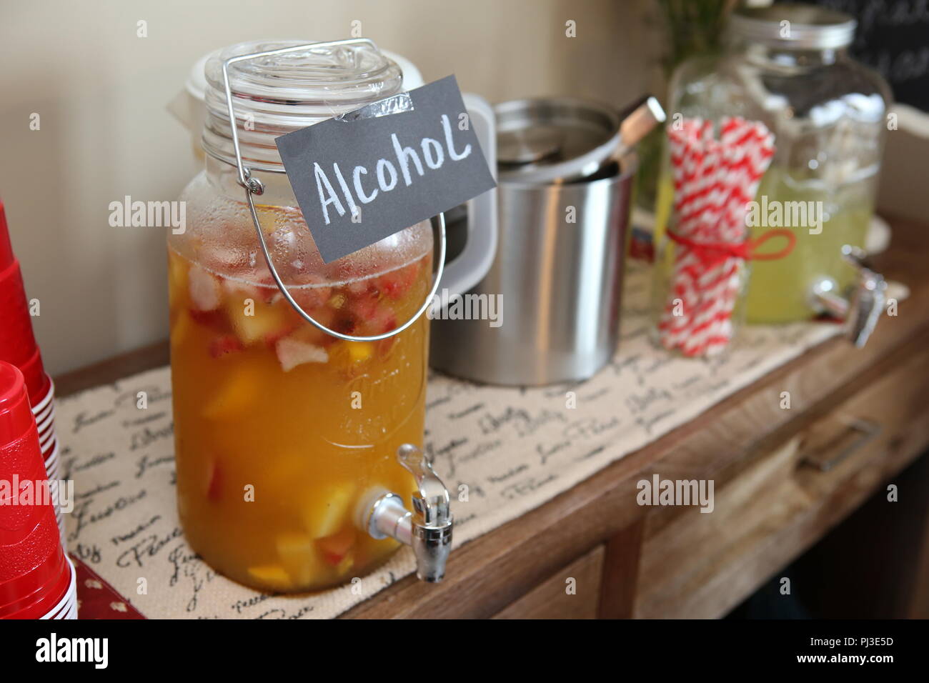 jar of alcoholic drink at party Stock Photo - Alamy