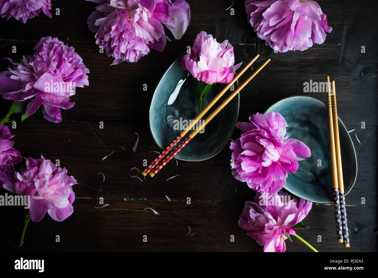 Summer table setting with pink peony flowers on rustic background with copy space Stock Photo ...