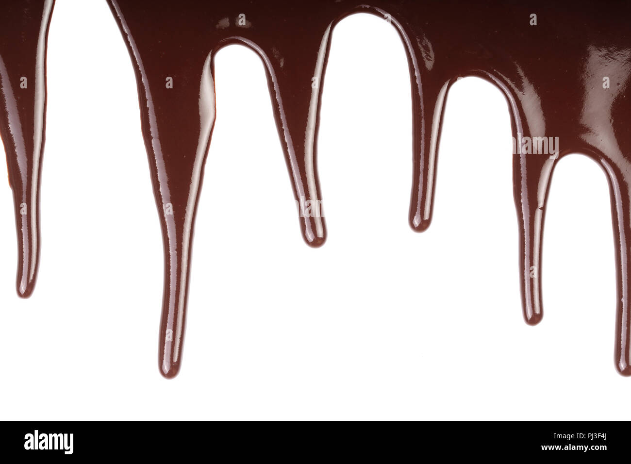 Melted chocolate dripping isolated on white background Stock Photo - Alamy