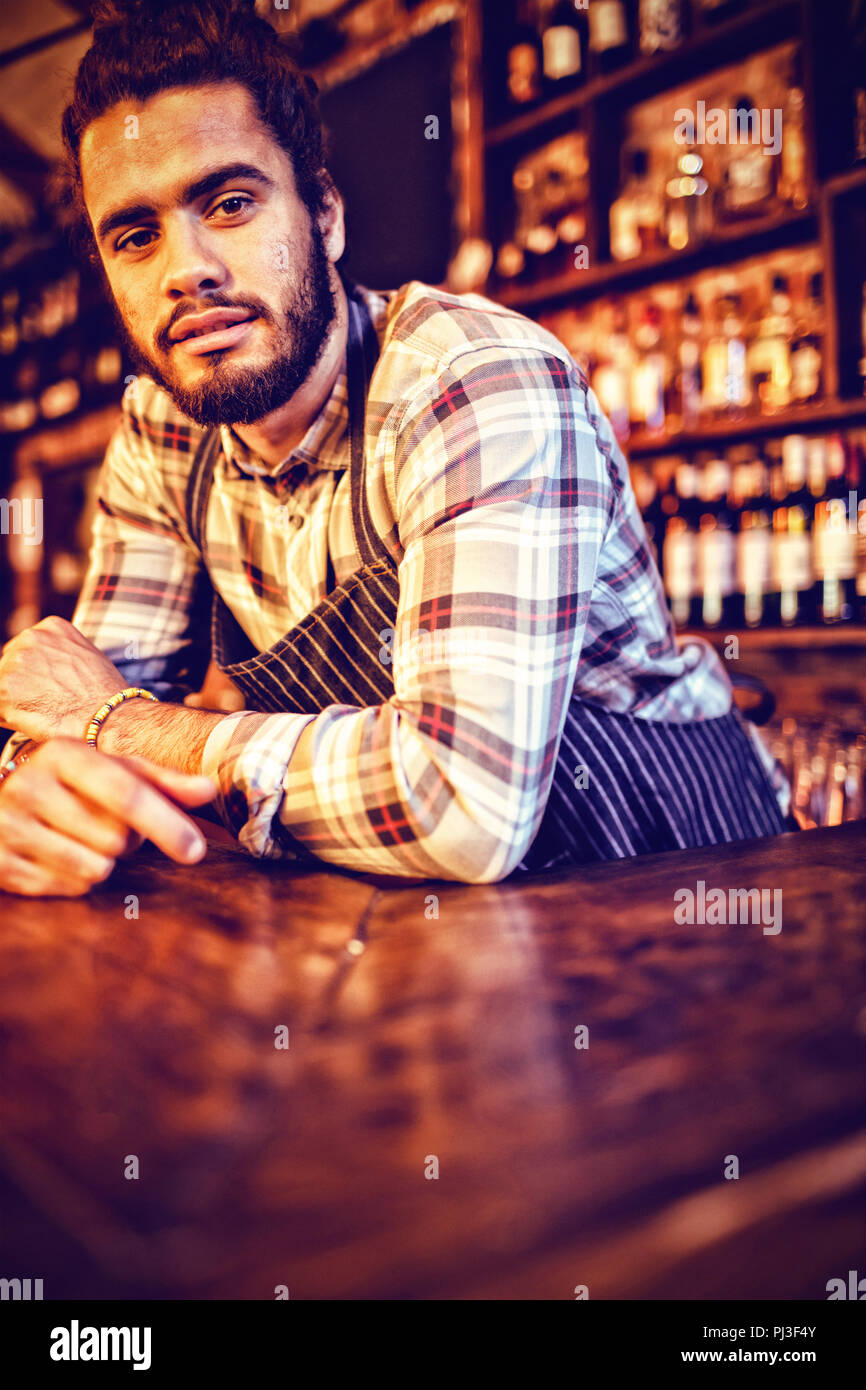 Portrait of waiter leaning at counterÃ‚Â Stock Photo - Alamy