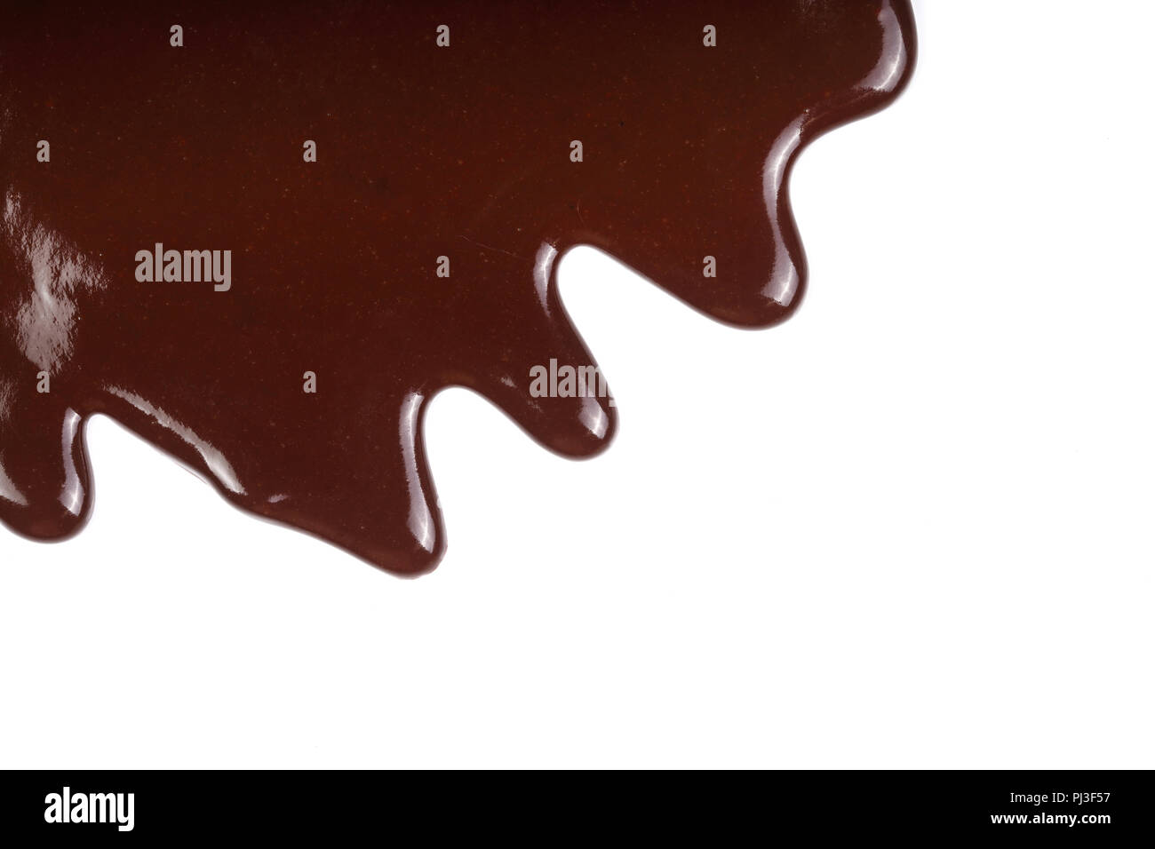 Melted chocolate dripping isolated on white background Stock Photo - Alamy