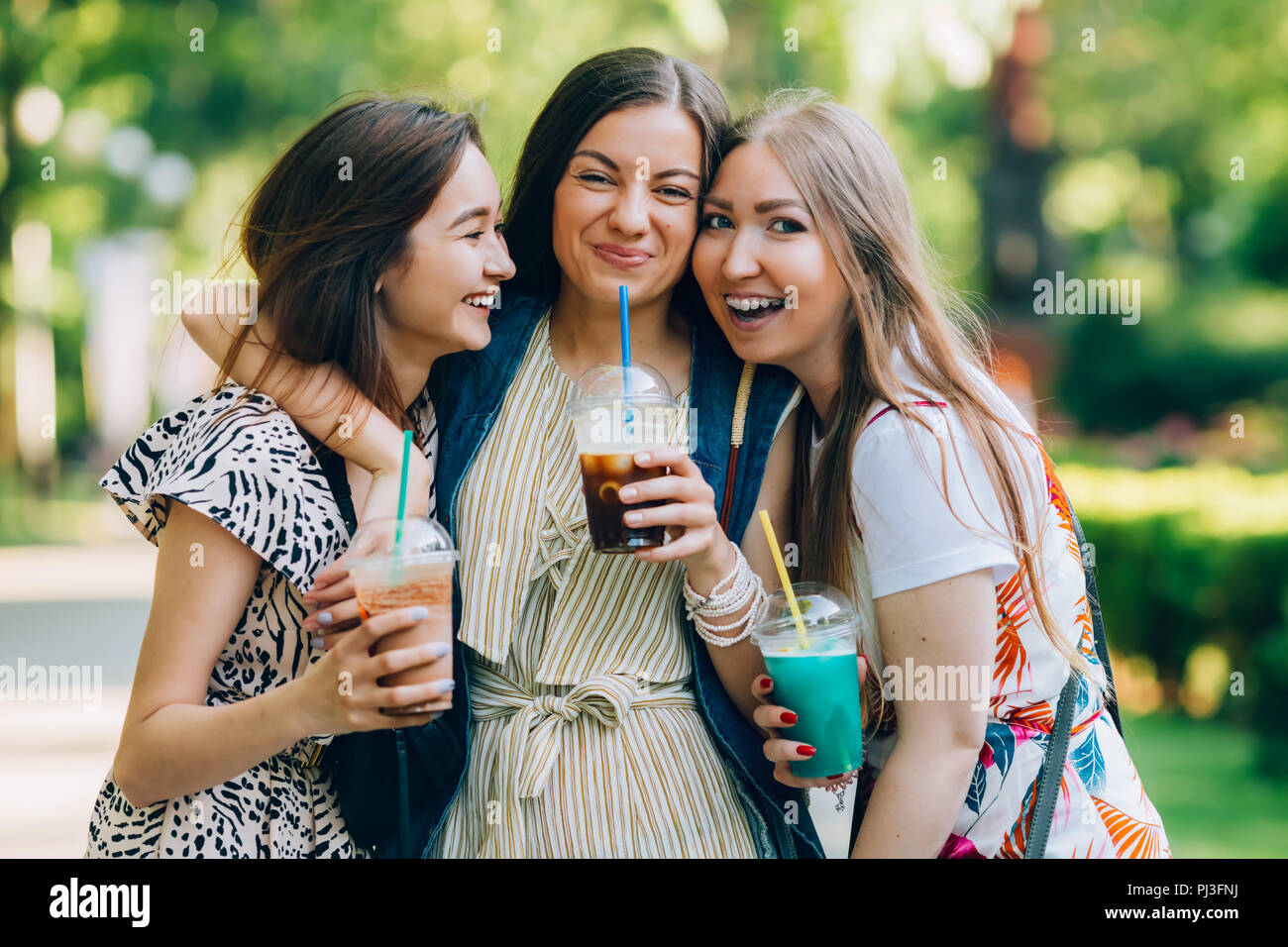 Summer lifestyle portrait multiracial women enjoy nice day, holding ...