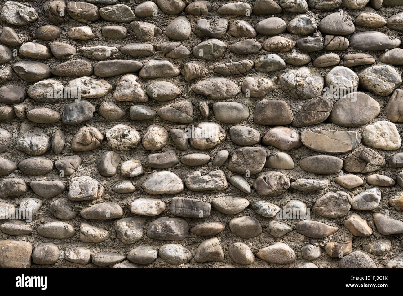 Old stone wall made with irregular blocks background texture with high ...