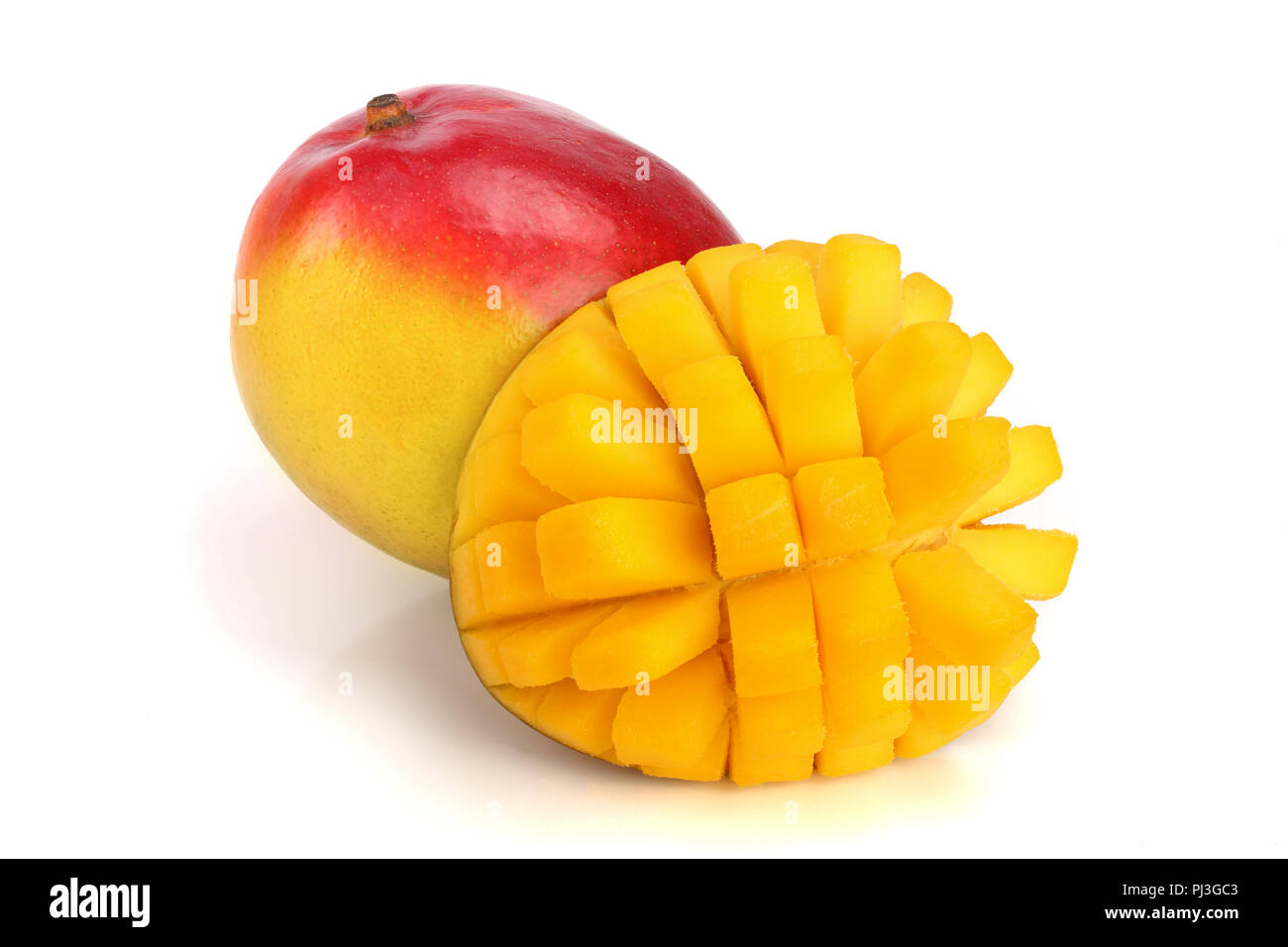 Mango fruit and half isolated on white background close-up Stock Photo ...