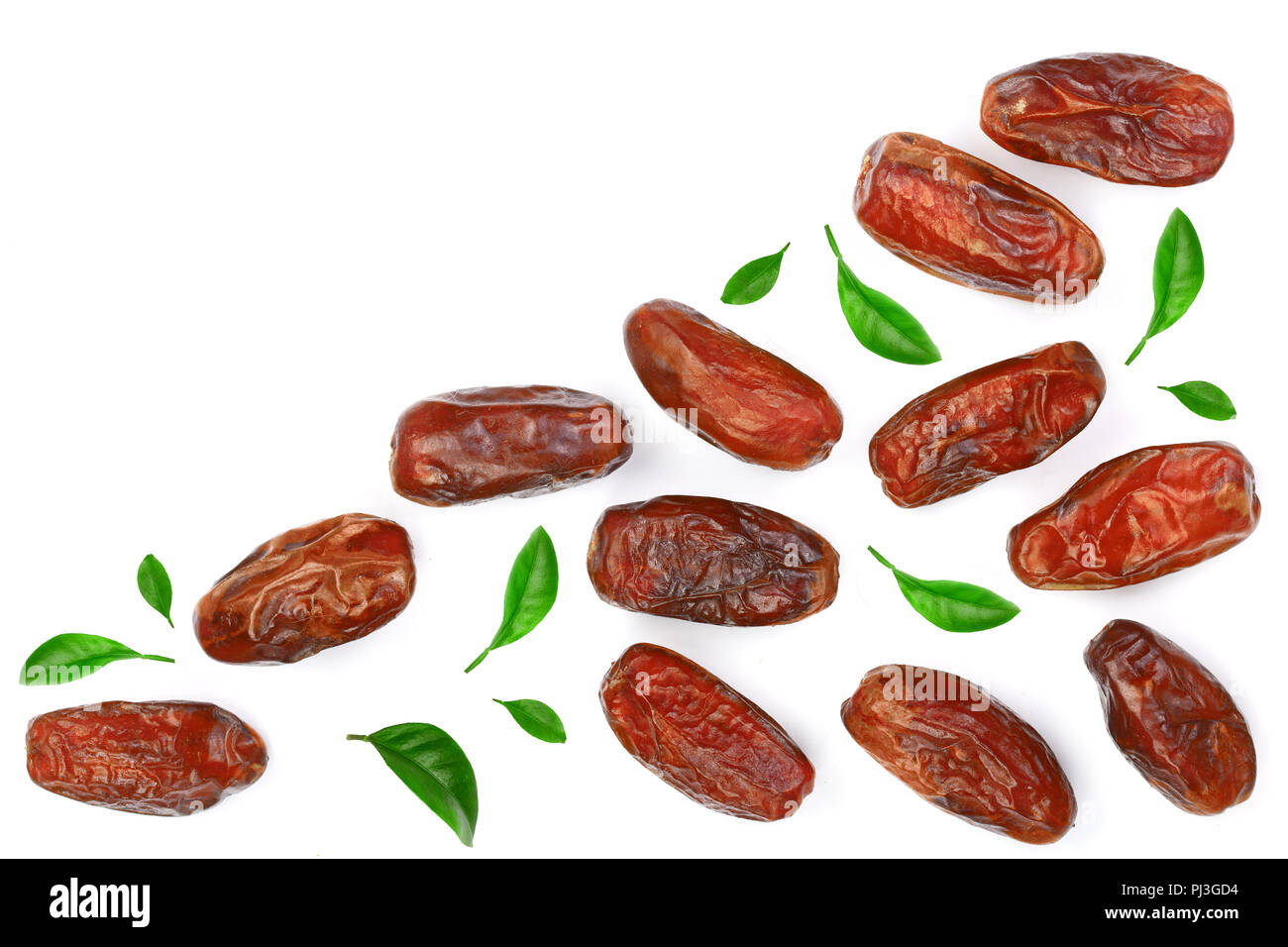 dry dates decorated with leaves isolated on white background with copy ...