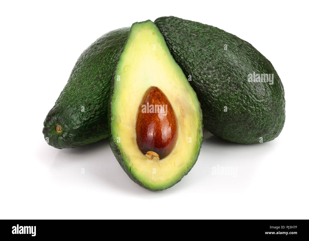 whole and half avocado isolated on white background close-up. Top view ...