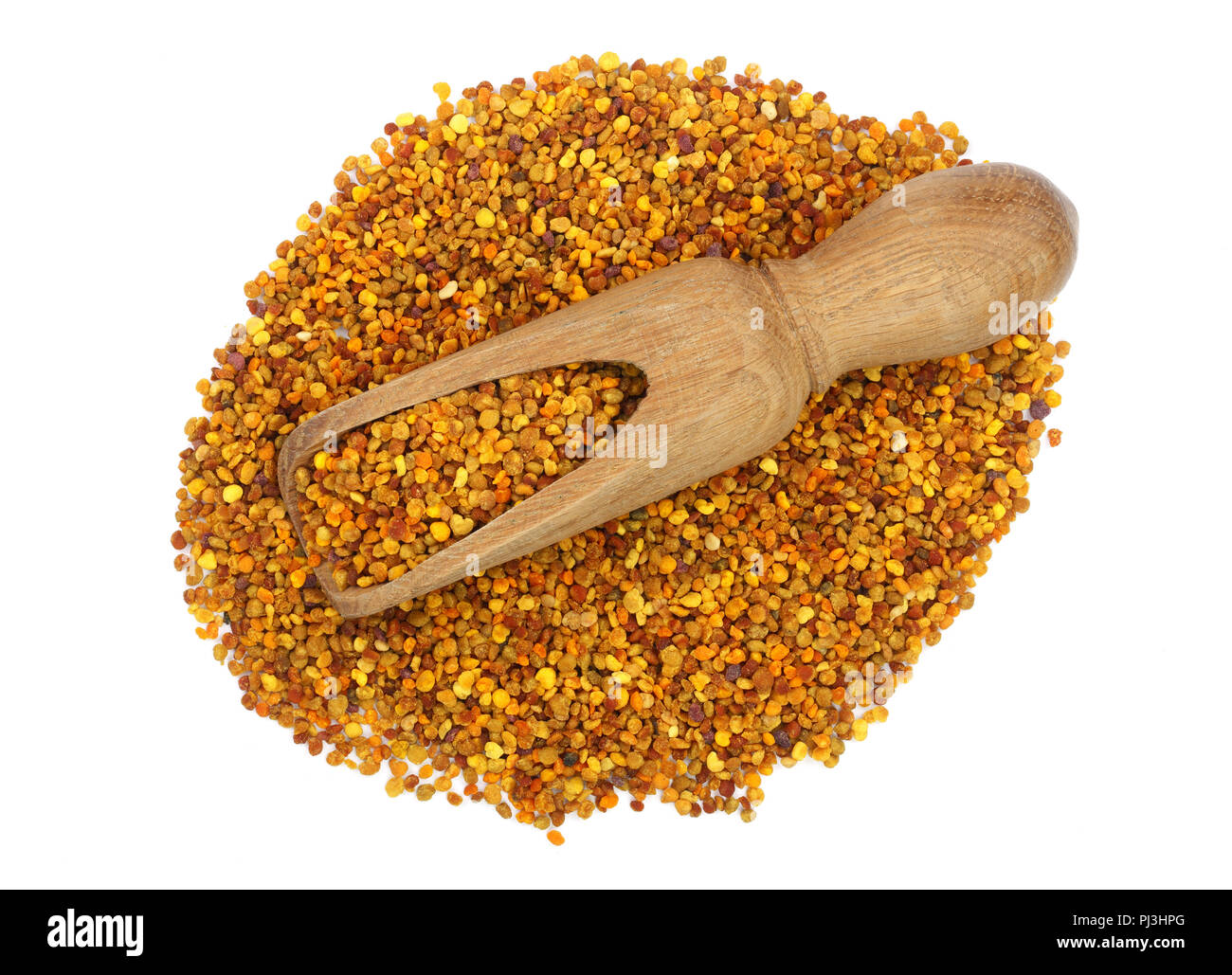 fresh bee pollen in wooden scoop isolated on white background. Top view ...