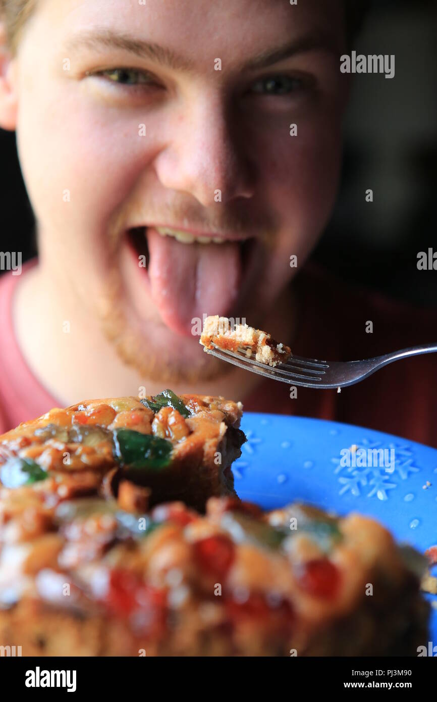 young adult eating food with hands Stock Photo - Alamy