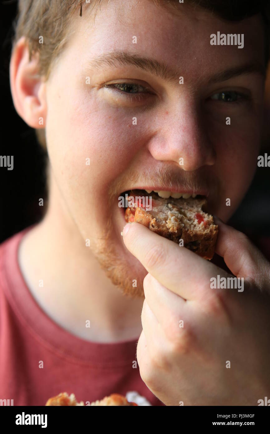 Man eating cake with his hands hi-res stock photography and images - Alamy