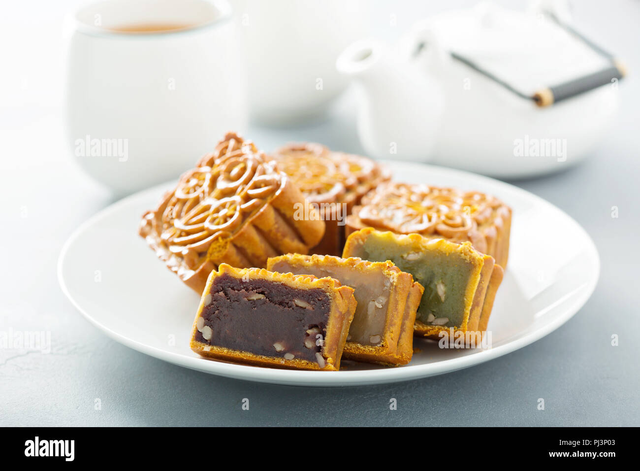 Traditional Chinese mooncakes with lotus and bean paste and kernel cut ...