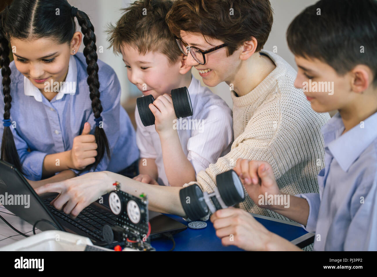Happy children learn programming using laptops on extracurricular ... Happy children learn programming using laptops on extracurricular ...