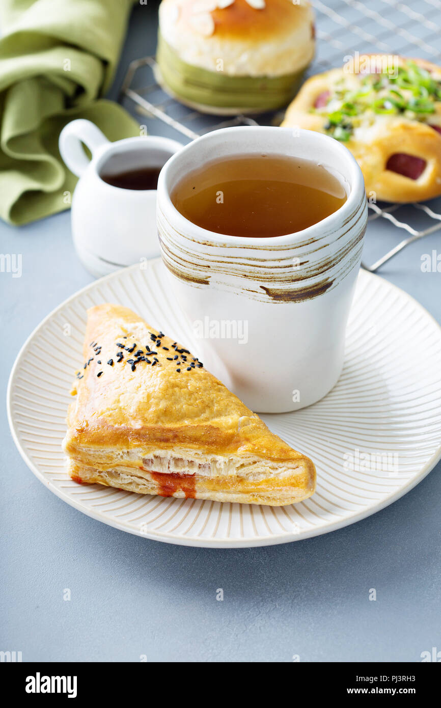 Red bean puff pastry served with green tea Stock Photo - Alamy