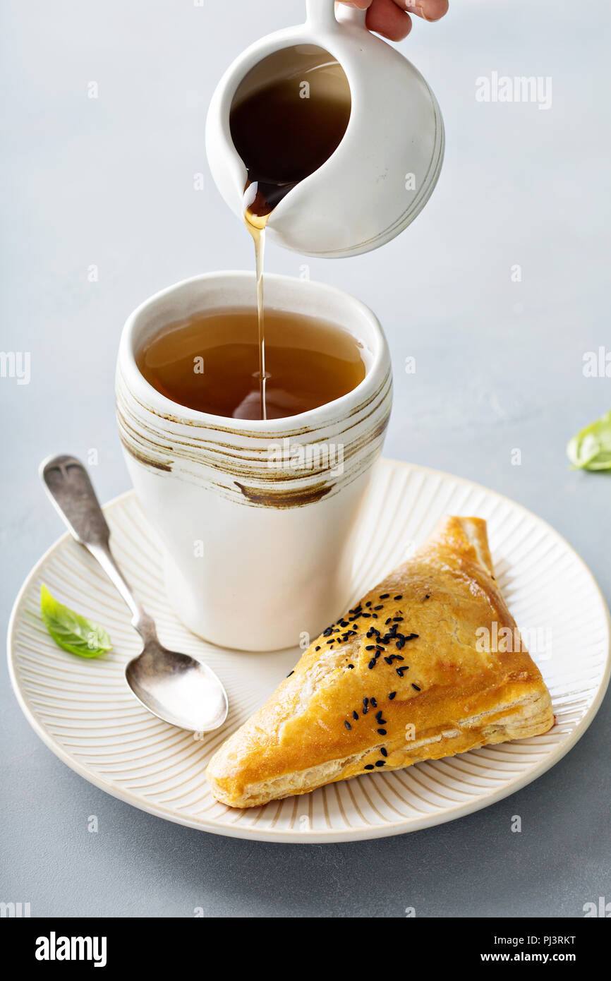 Red bean puff pastry served with green tea Stock Photo - Alamy