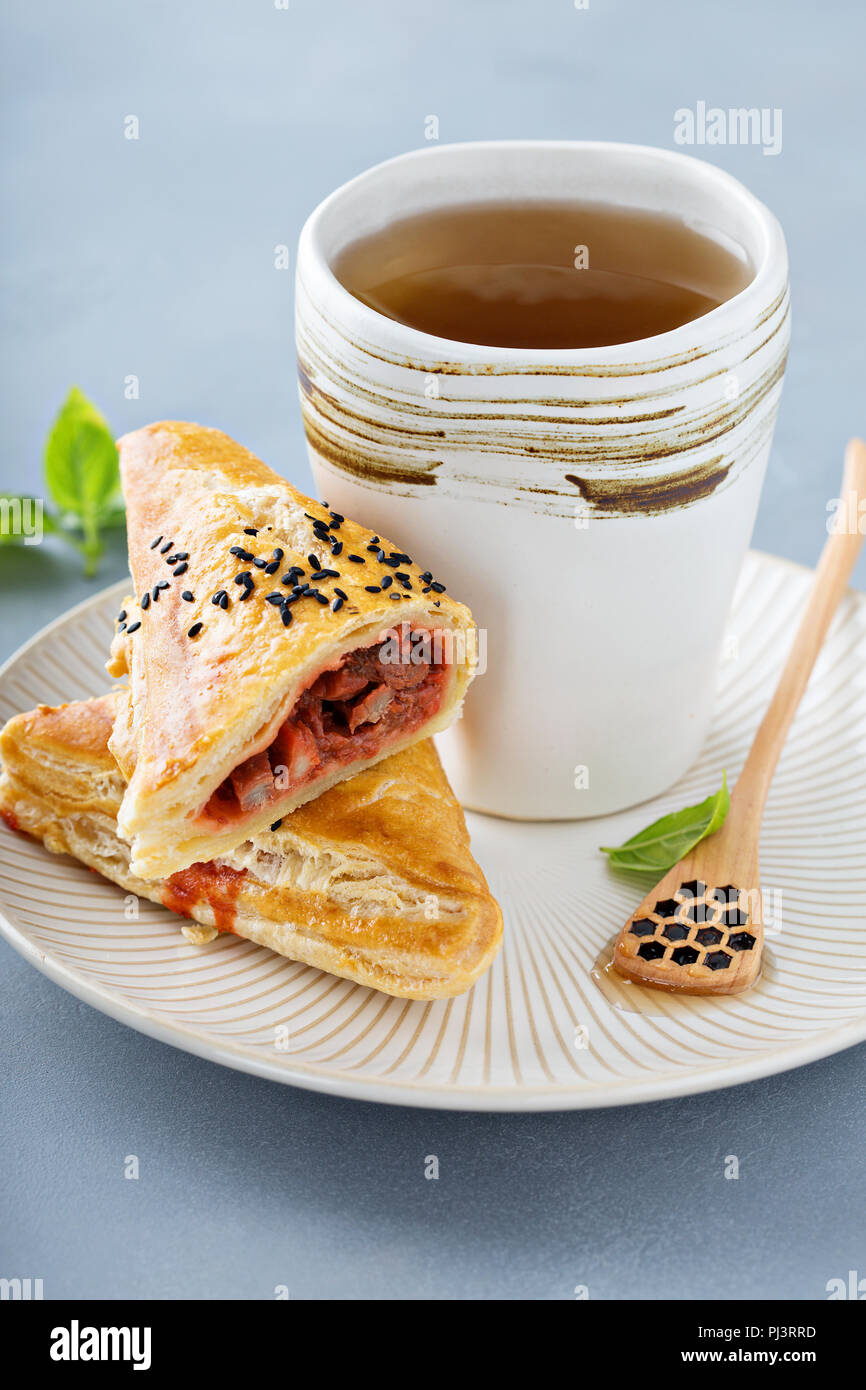 Red bean puff pastry served with green tea Stock Photo - Alamy
