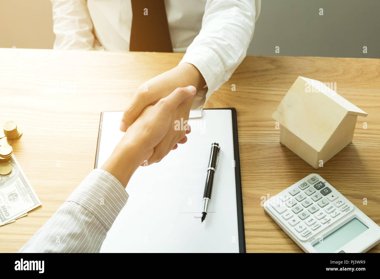 Business handshake. Business people shaking hands, finishing up a ...