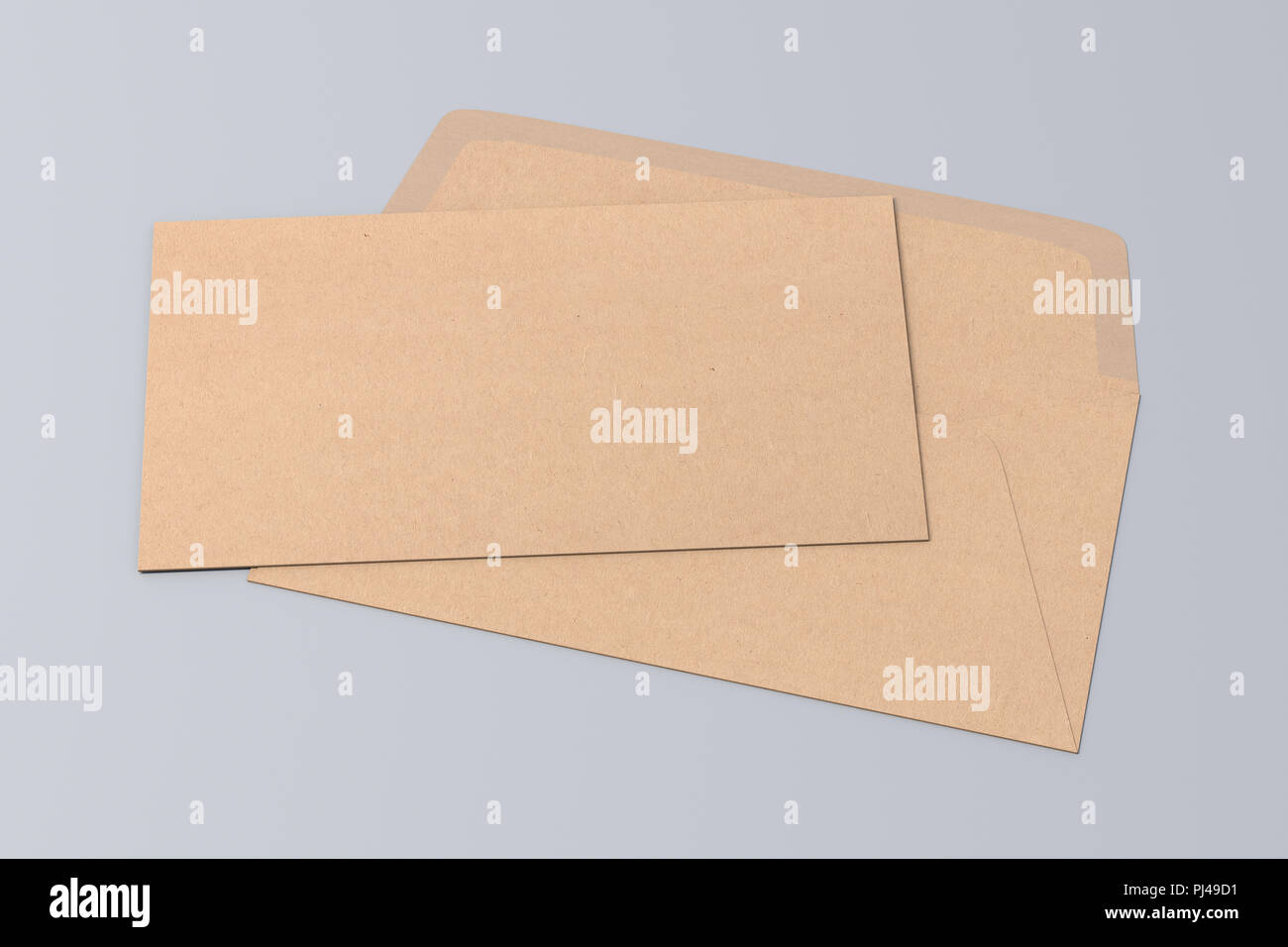 Craft paper blank closed envelope on opened envelope on white ...