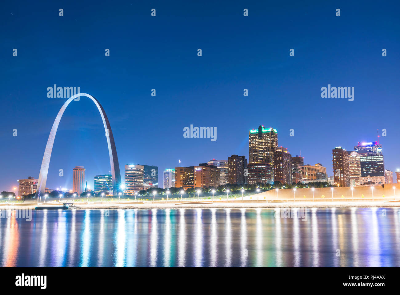 st. louis skyscraper at night with reflection in river,st. louis ...
