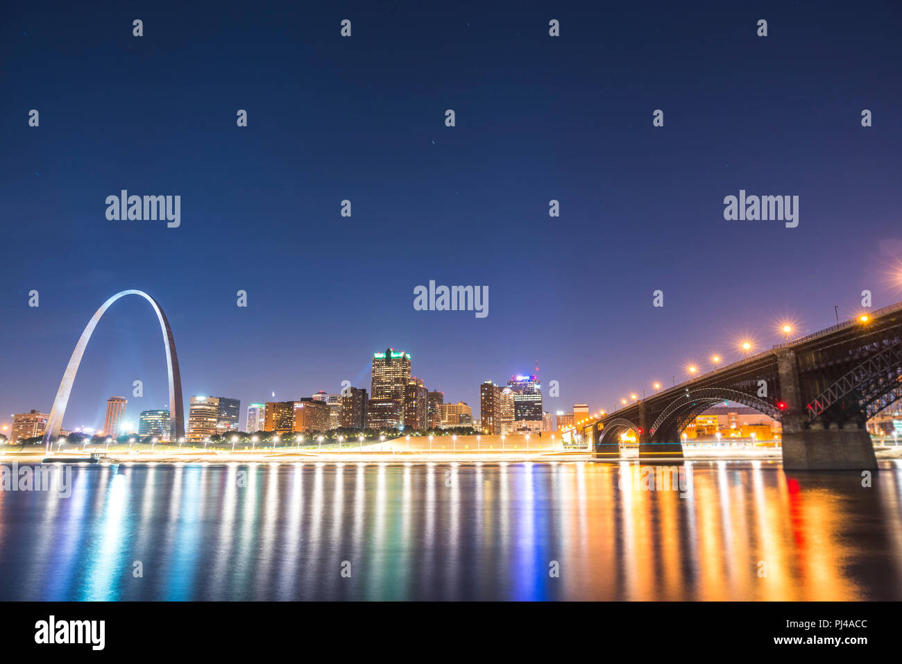 st. louis skyscraper at night with reflection in river,st. louis ...